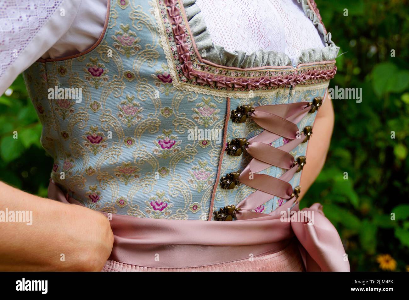 a woman in a beautiful traditional Bavarian dirndl dress at the ...