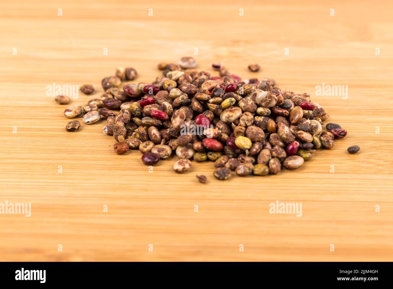 Whole dried sumac berries on a wood cutting board Stock Photo - Alamy