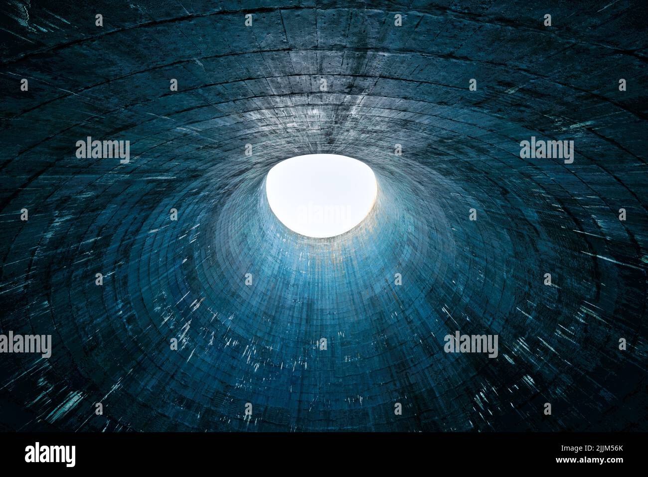 The abstract blue background with a bright light in the center Stock ...