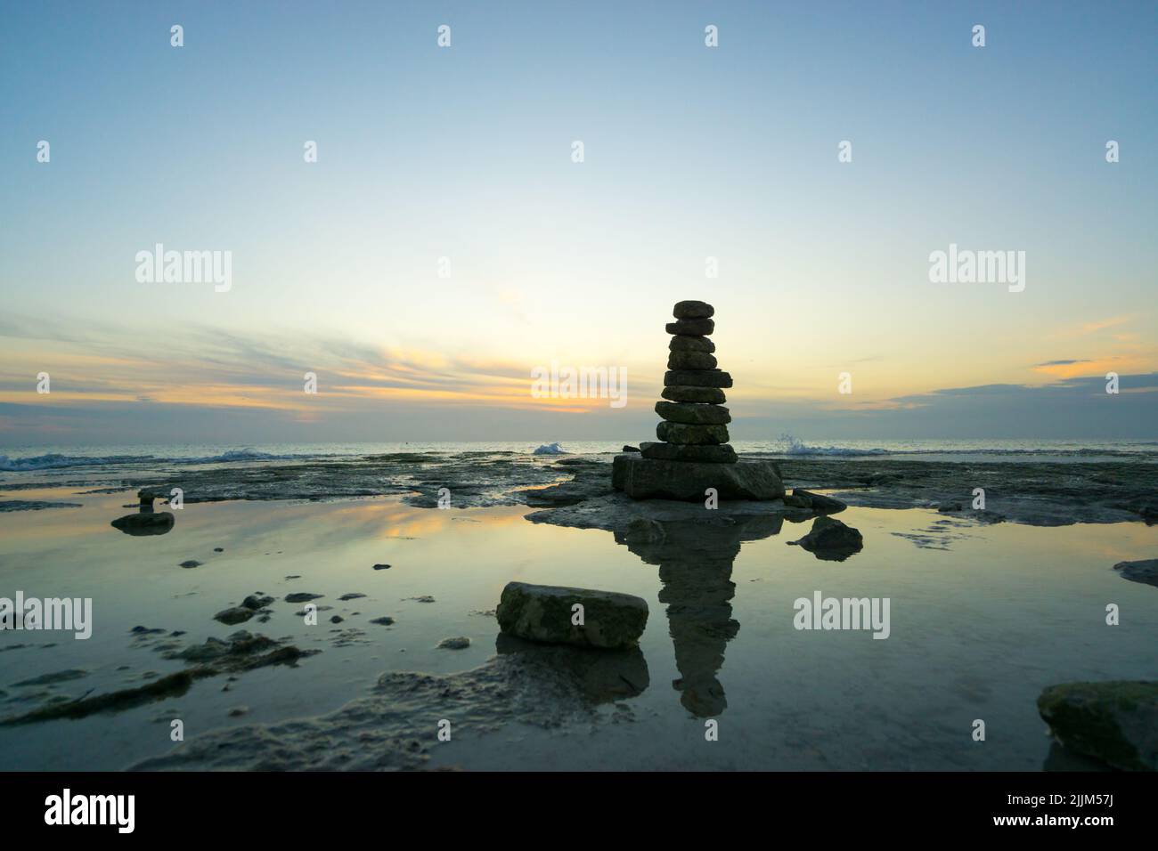 The beautiful view of the rock tower against the background of sea and ...