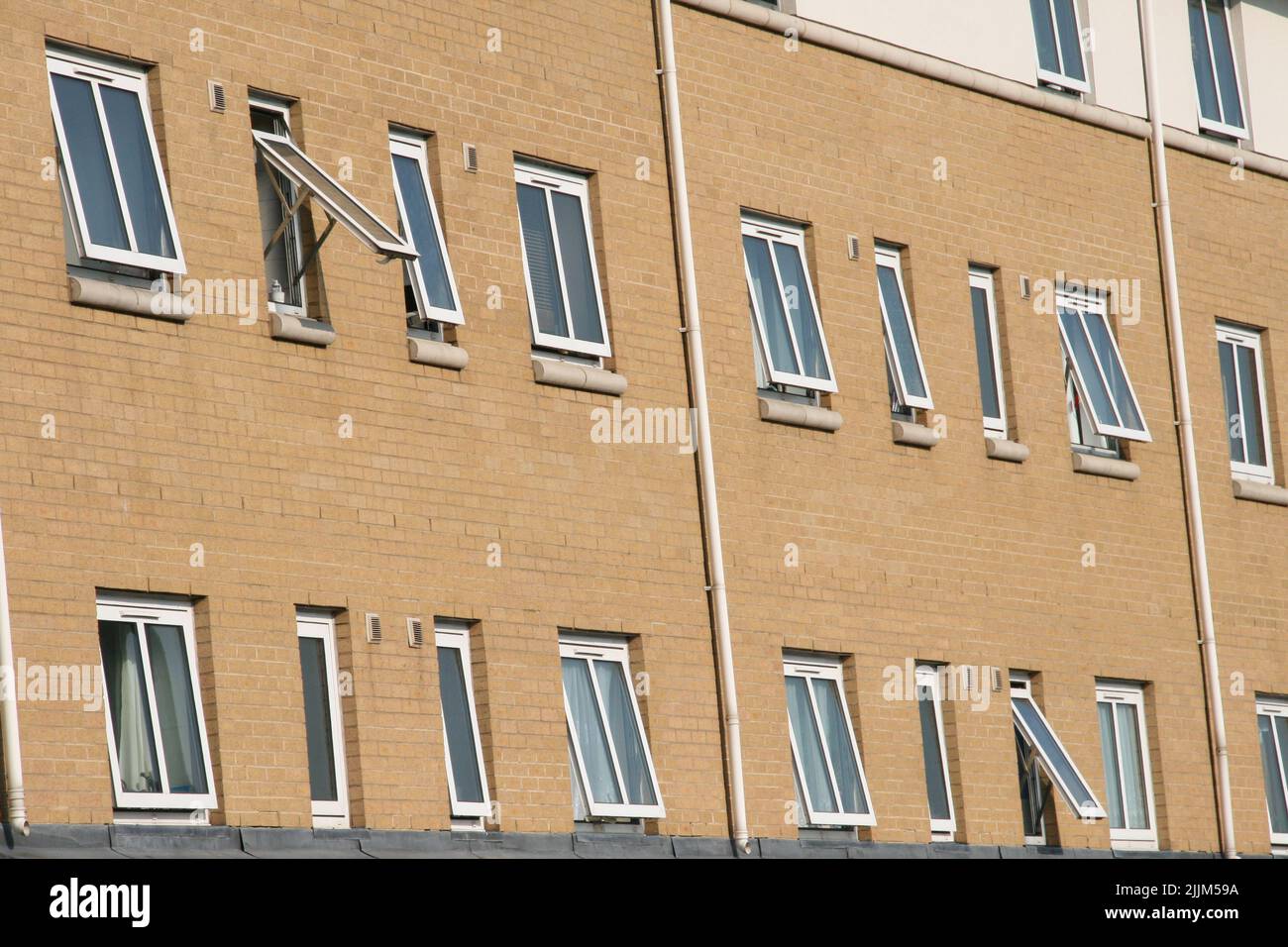 A low angle shot of the exterior design of a building in the daylight ...