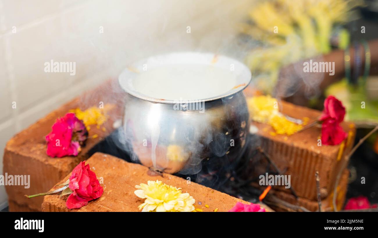 A close-up shot of an Indian metallic boiling pot on some bricks Stock ...