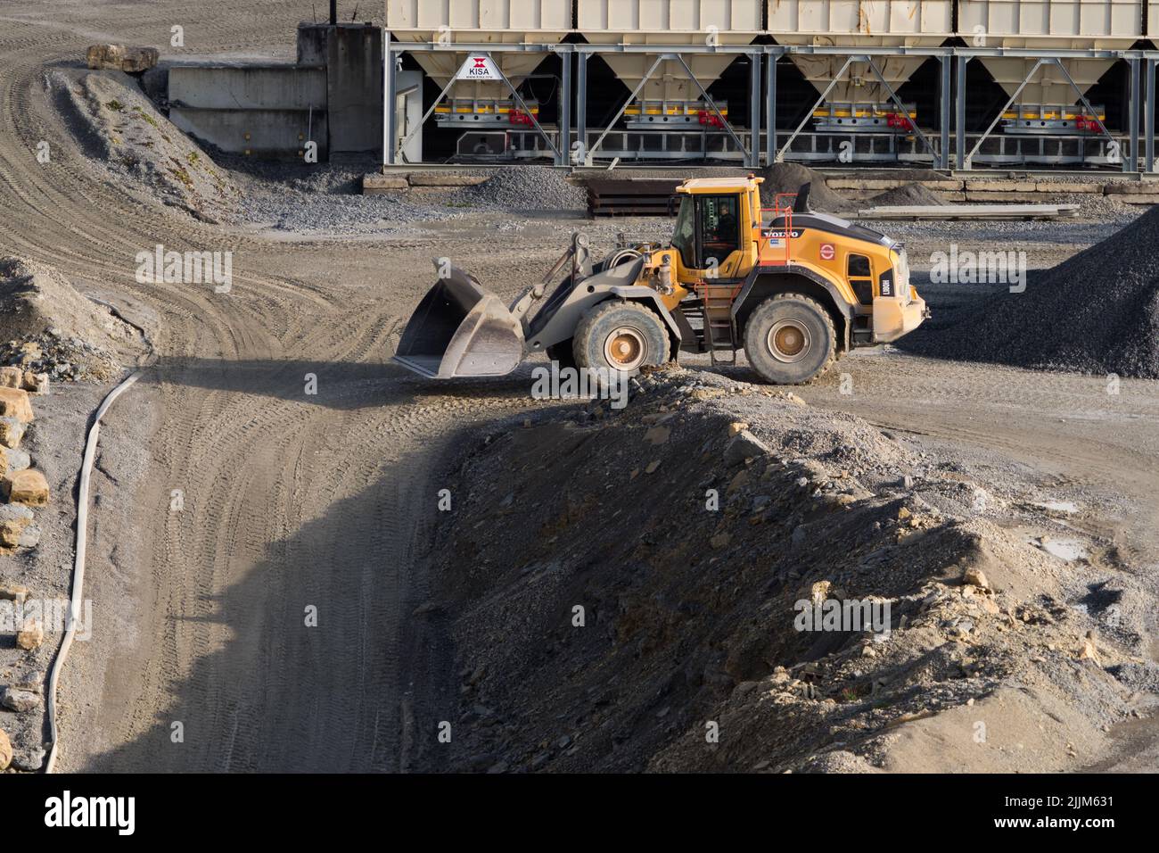 The construction area with the working excavator in the countryside in ...