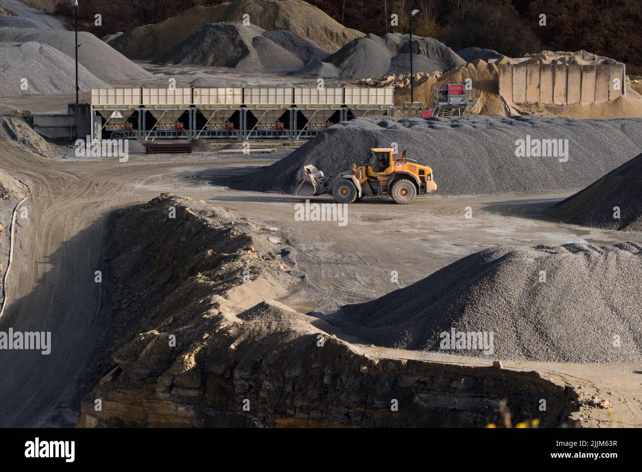 The construction area with the working excavator in the countryside in ...