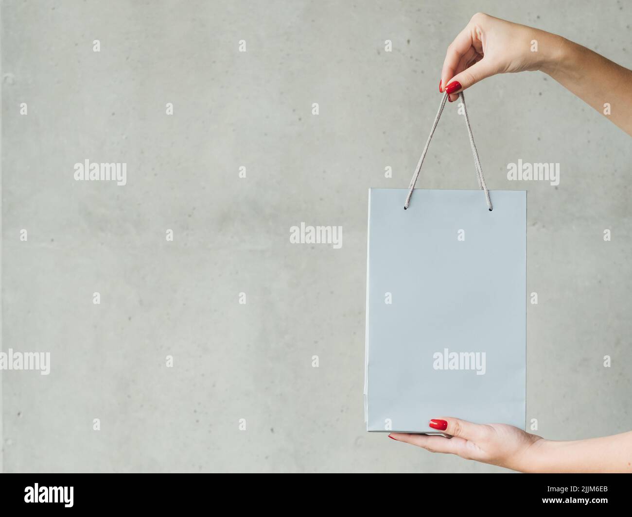 Hand giving present hi-res stock photography and images - Alamy