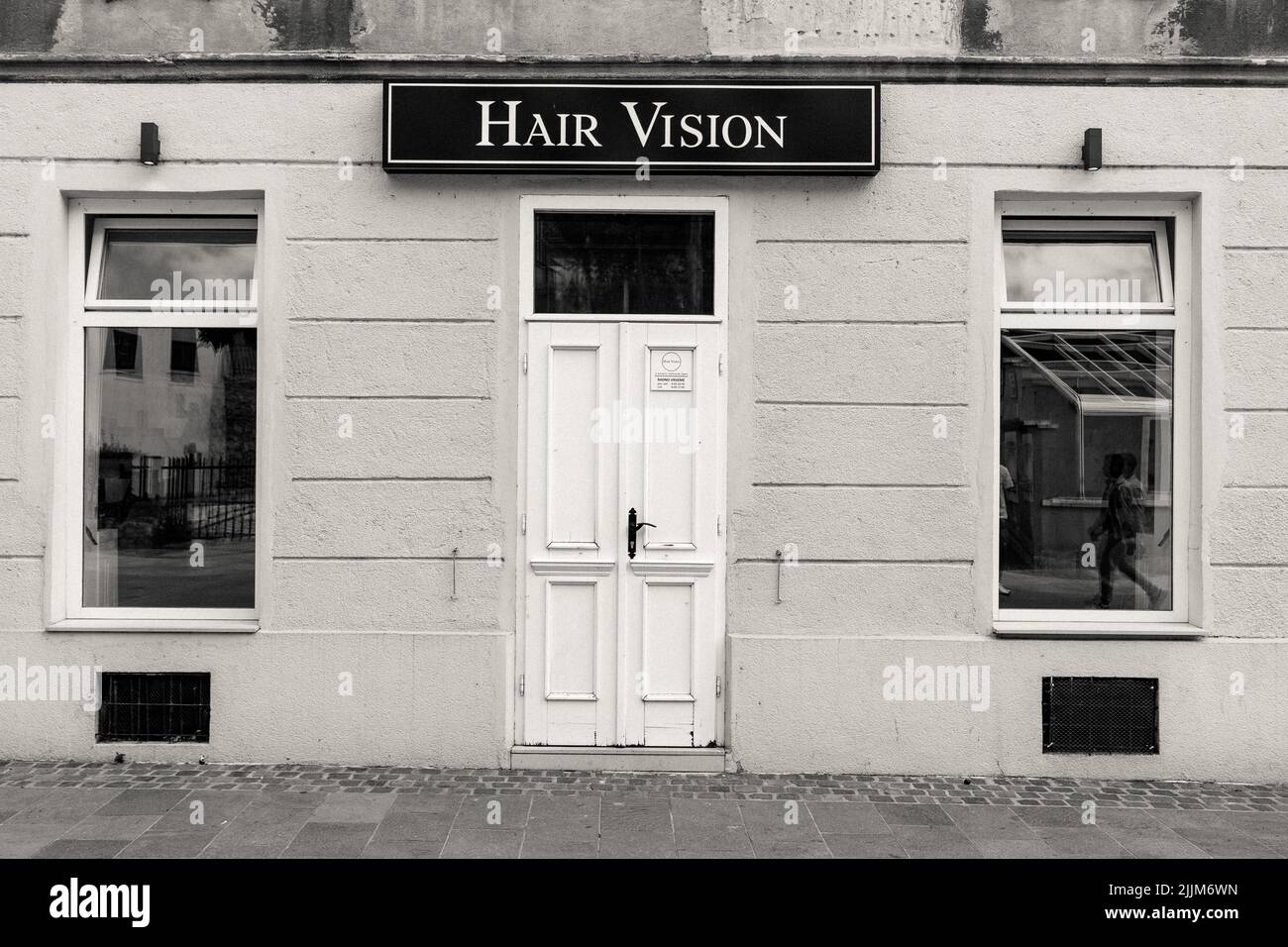 A grayscale shot of a Hair Vision salon facade in Zagreb, Croatia Stock ...