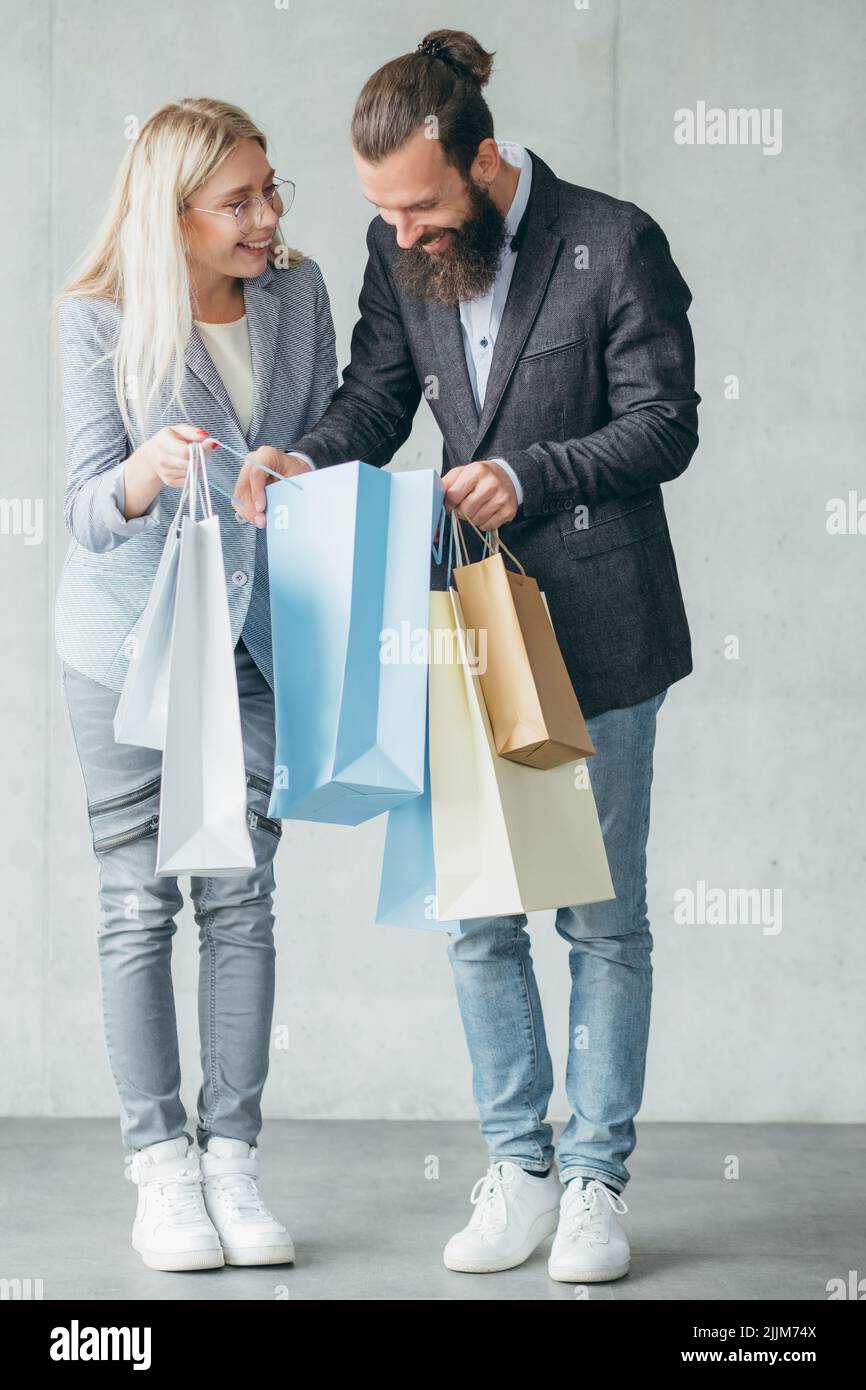 shopping surprise woman show purchase man bags Stock Photo - Alamy