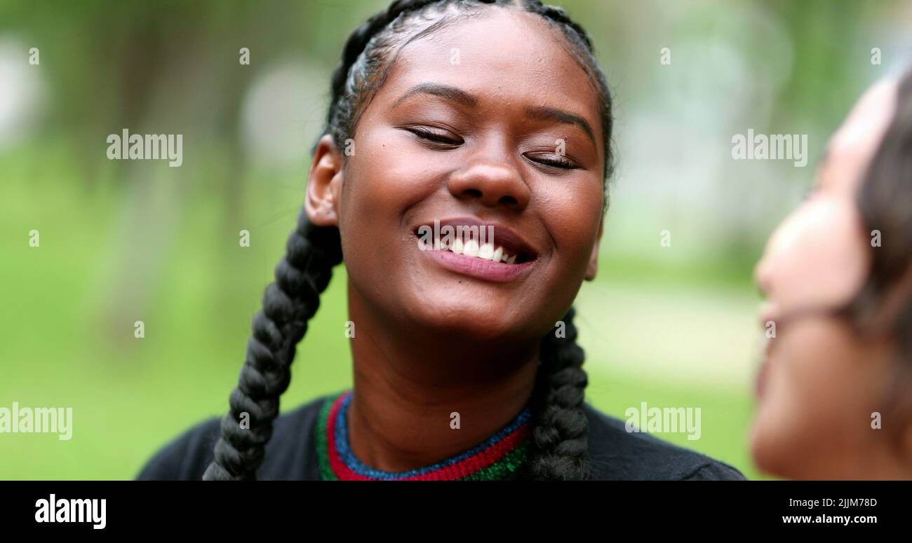 Candid female friends talking outside, real life laugh and smile Stock ...