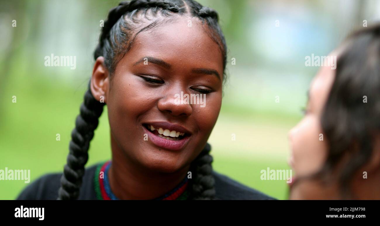 Candid female friends talking outside, real life laugh and smile Stock ...