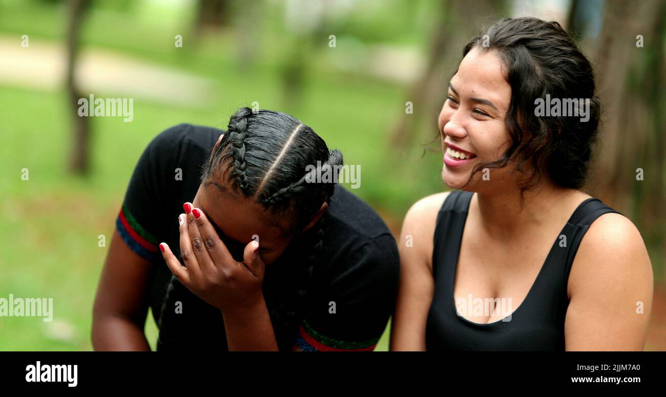 Candid female friends talking outside, real life laugh and smile Stock ...