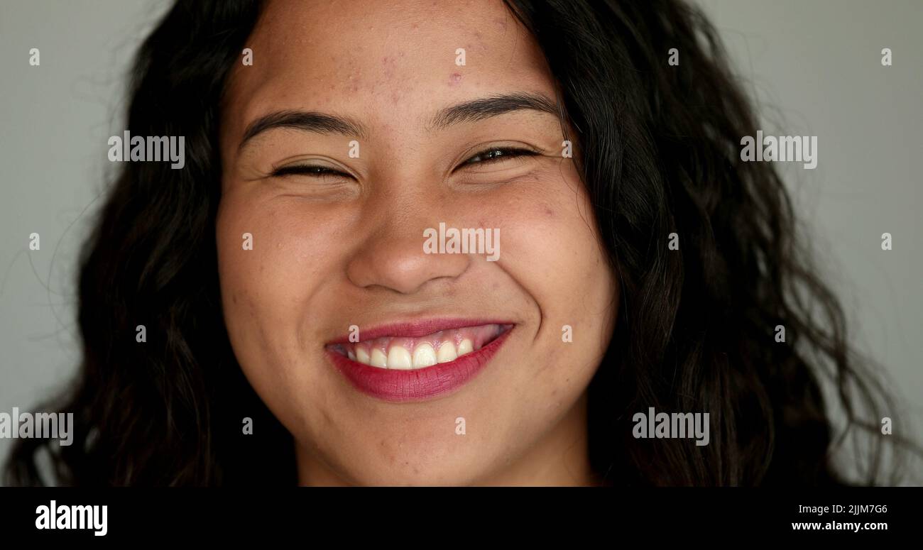 Casual hispanic girl laughing and smiling. Latina young woman real life ...