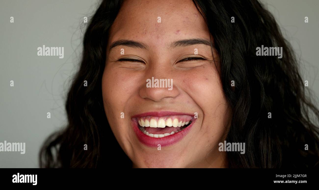 Casual hispanic girl laughing and smiling. Latina young woman real life ...