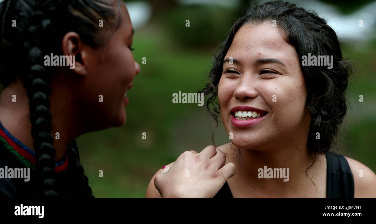 African woman putting coins inside piggy bank. Person saving money ...