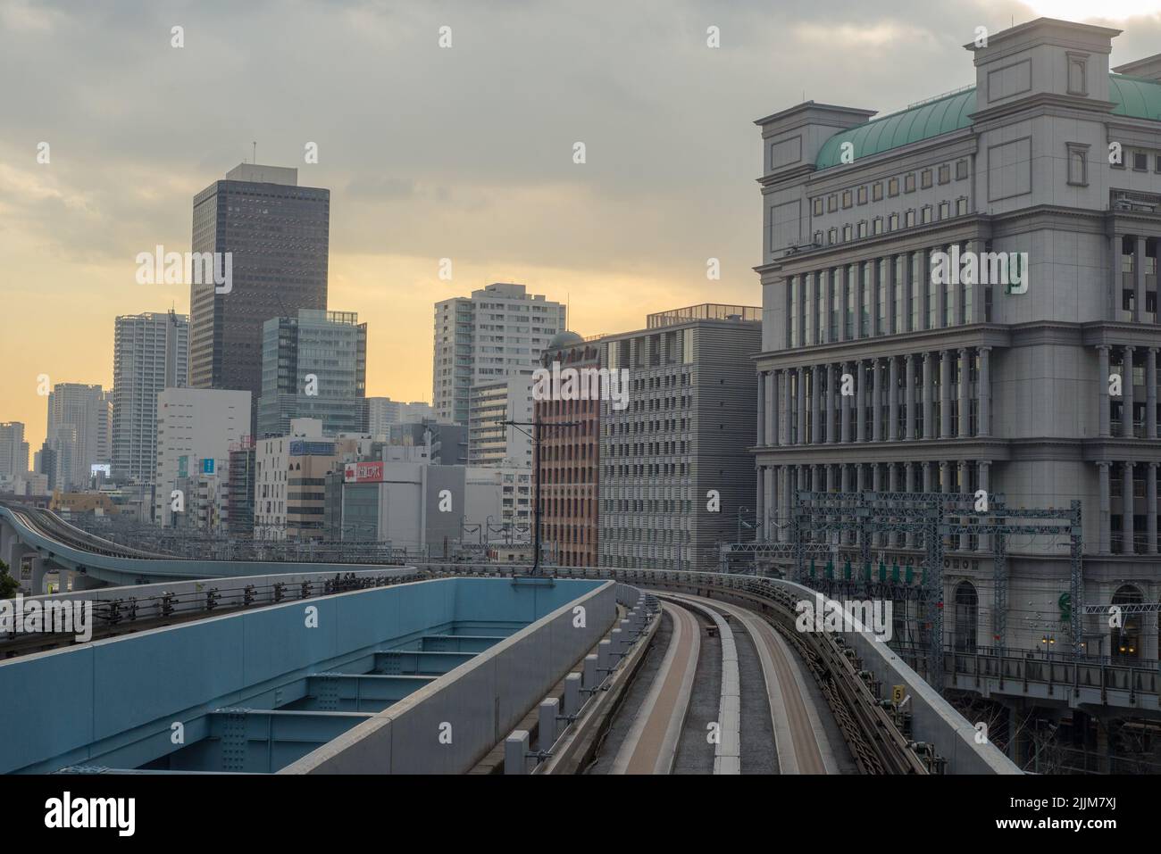 The monorail tracks in urban Tokyo, Japan with large buildings in the ...