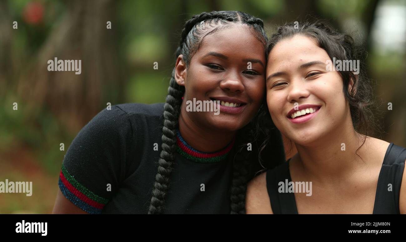 Diverse girlfriends smiling at camera together. Ethnically diversity ...