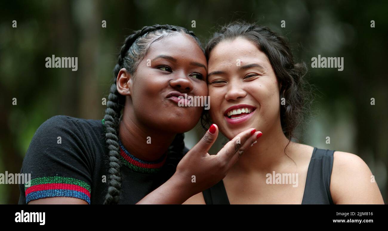 Ethnically diverse girlfriends posing together. African and hispanic ...