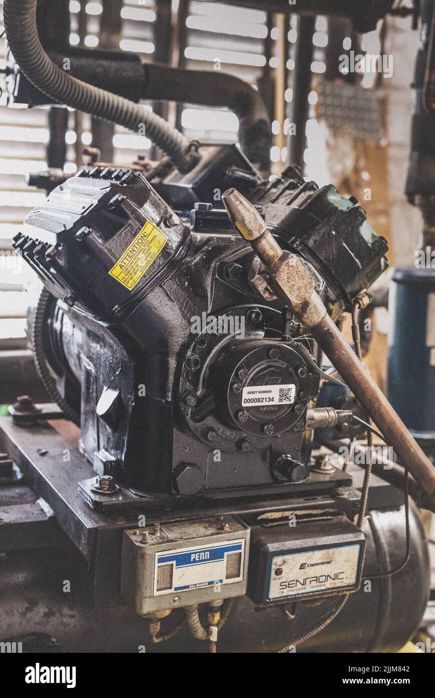 A vertical shot of a refrigeration compressor in a supermarket Stock ...