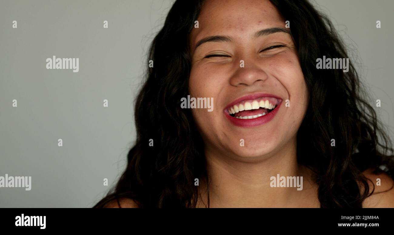 Excited happy hispanic girl cheering success reaction to great news ...