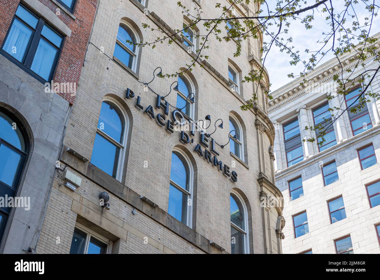 A low angel shot of the facade of the Hotel Place d'Armes with front ...