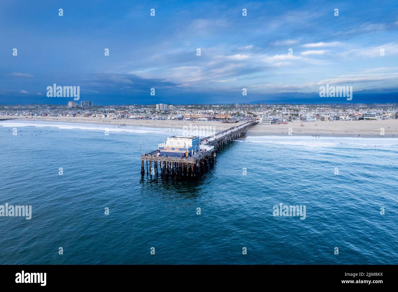 An aerial view of a beach pier under the cloudy skies Stock Photo - Alamy