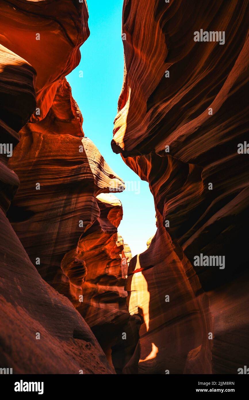 A vertical shot of Antelope Canyon under a clear sky in Lechee, Arizona ...