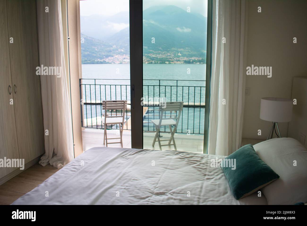Hotel Room Overlooking Lake Como Italy and hillside town Stock Photo ...