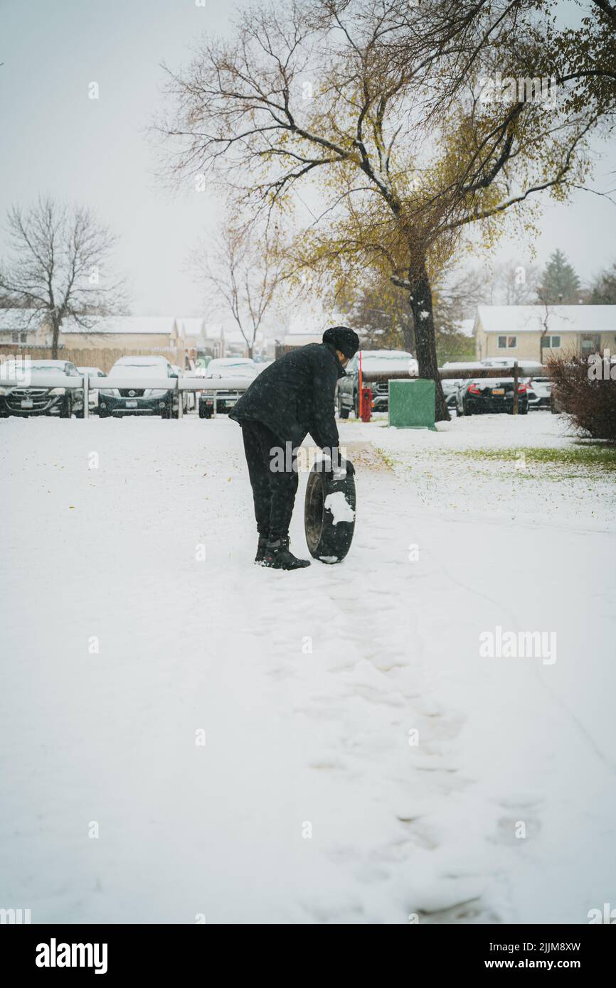 Man rolling wheel in hi-res stock photography and images - Alamy