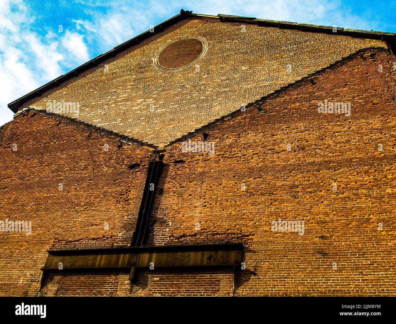 The exterior of an old brick factory building Stock Photo - Alamy