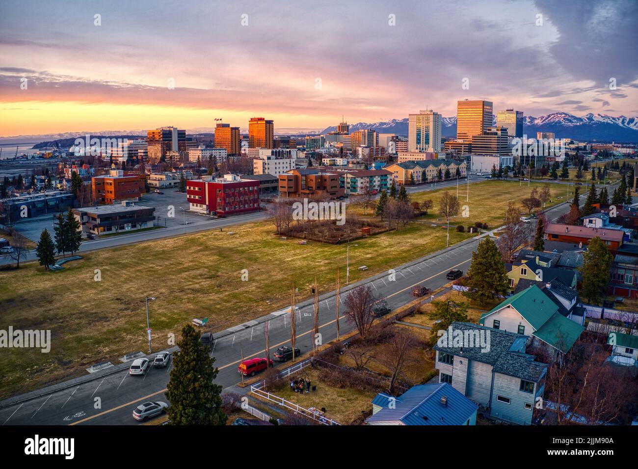An aerial view of a sunset over Downtown Anchorage, Alaska in Spring ...