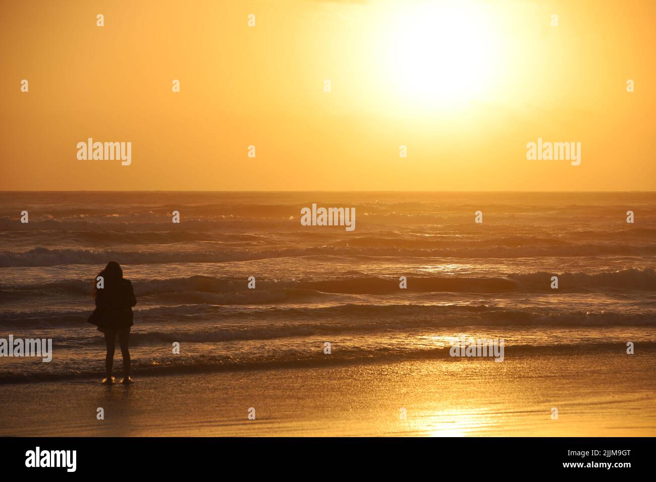 Person on a beach hi-res stock photography and images - Alamy
