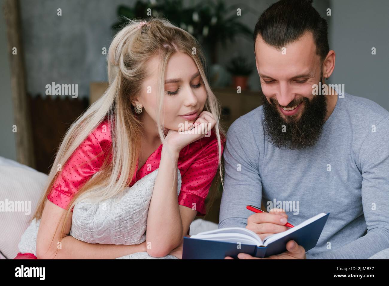 newlyweds honeymoon plan couple make notes Stock Photo - Alamy