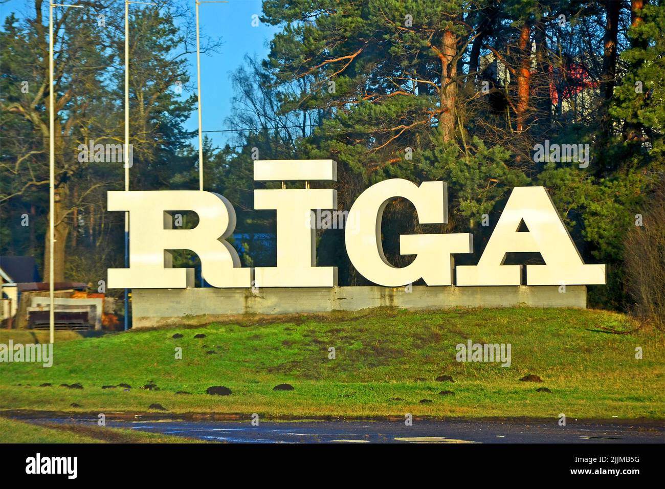 Riga city text message on the forest highway in Riga, Latvia Stock ...