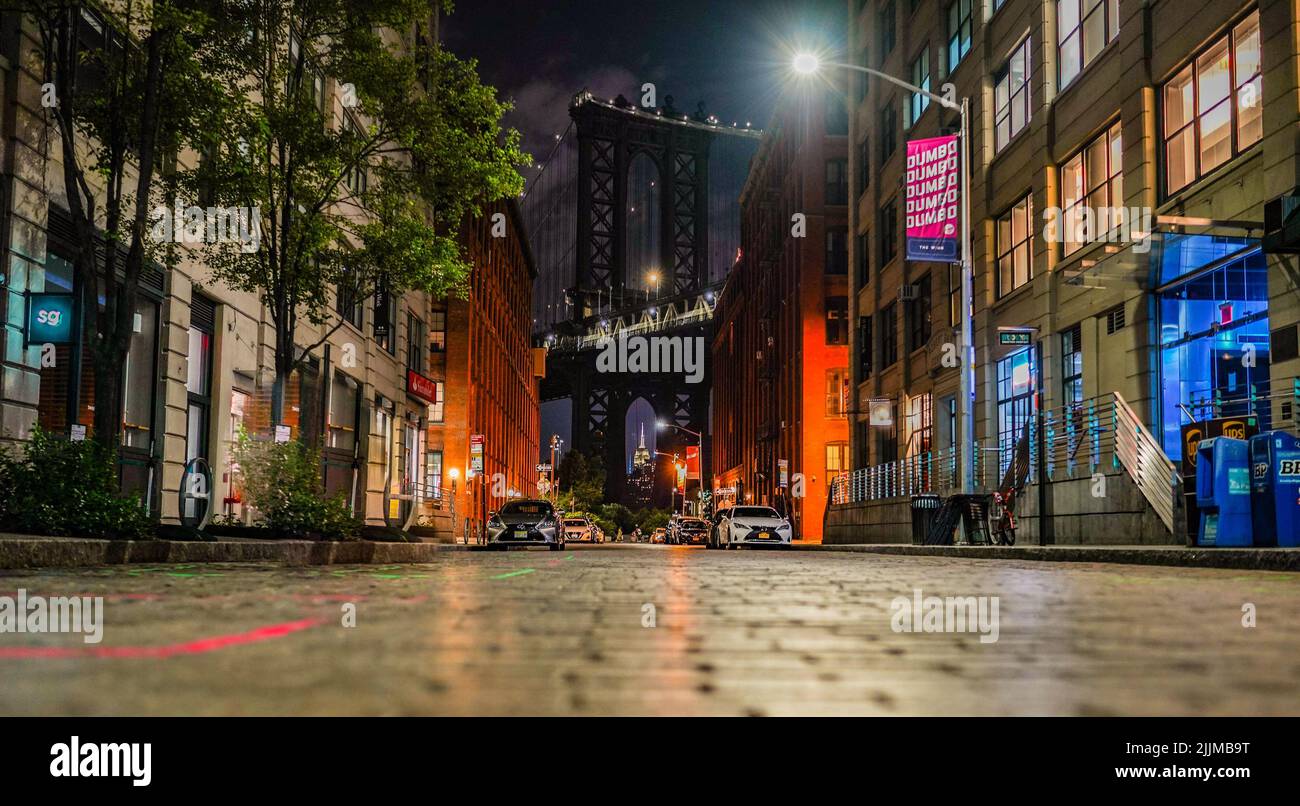 A scenic view of the Brooklyn Bridge in Dumbo, New York City at night ...