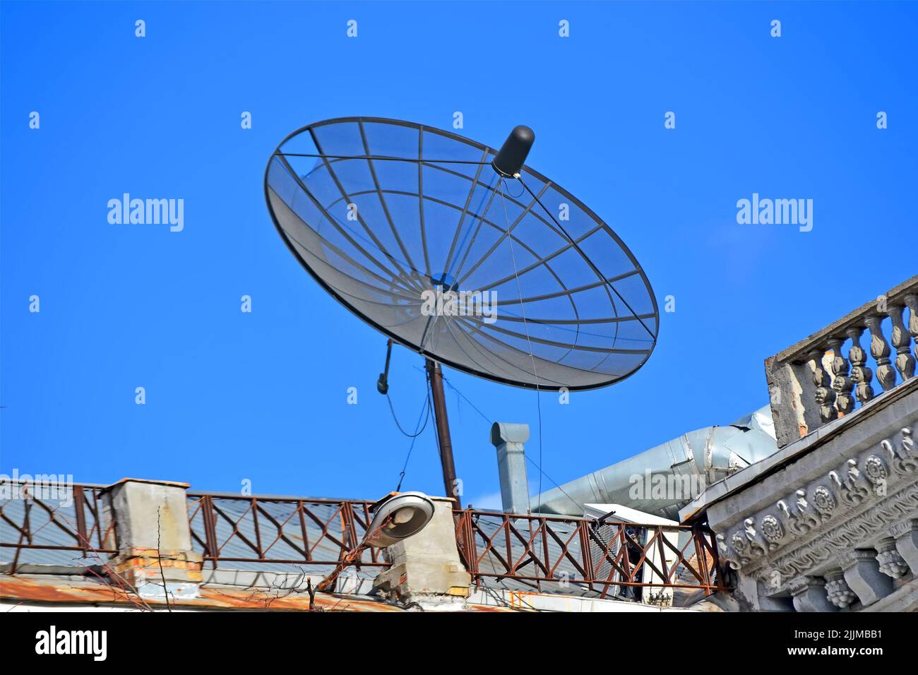 satellite antenna with converters on the building rooftop, modern ...