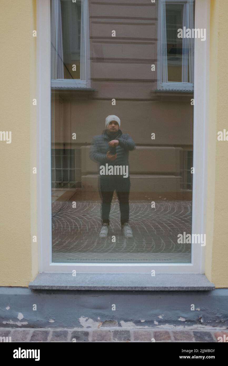 Man at window with camera hi-res stock photography and images - Alamy