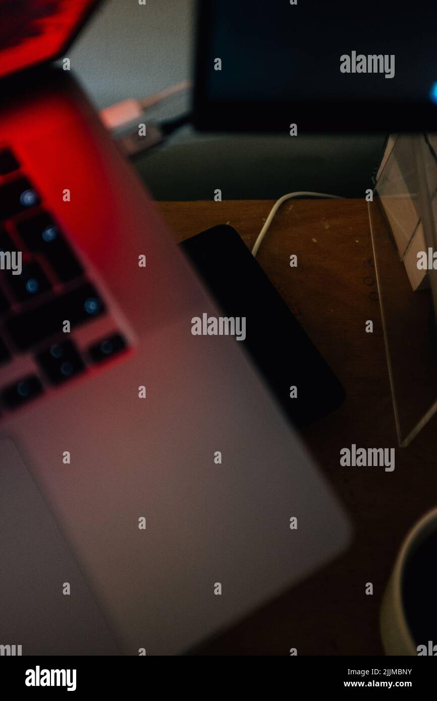 A vertical shot of a laptop connected to wires Stock Photo - Alamy