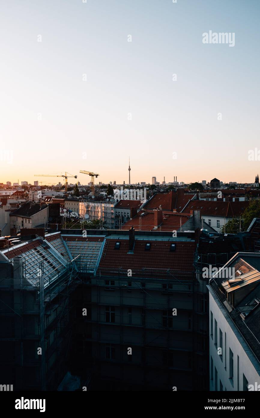 A vertical shot of a cityscape under a sunset sky Stock Photo - Alamy