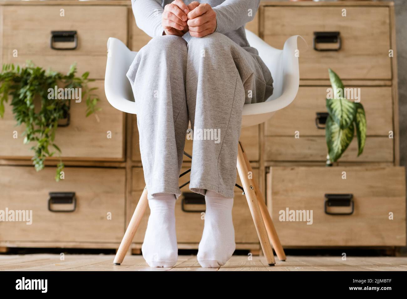 start day apprehension man sit chair tiptoed Stock Photo - Alamy