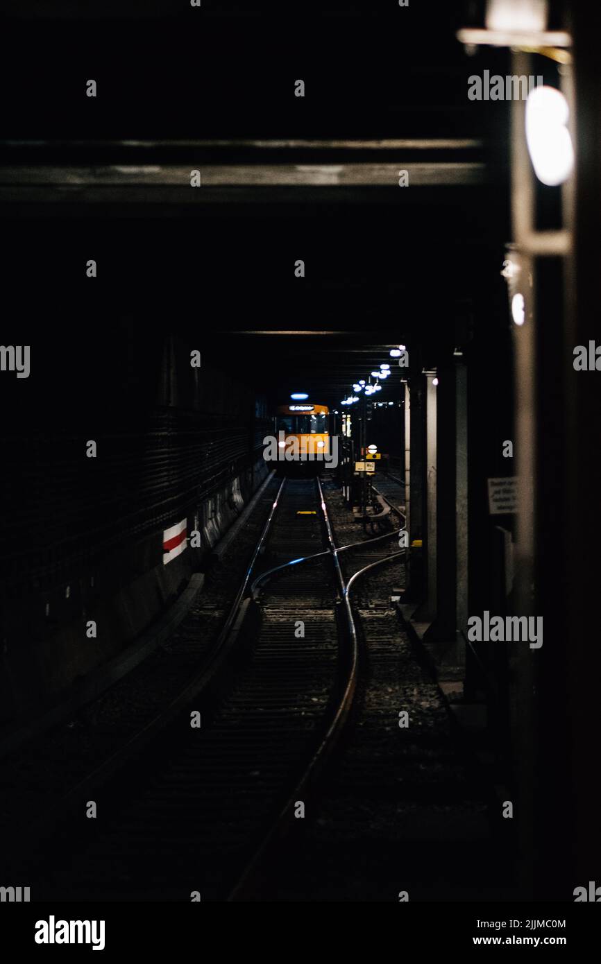 A vertical shot of moving train on railway in tunnel Stock Photo - Alamy