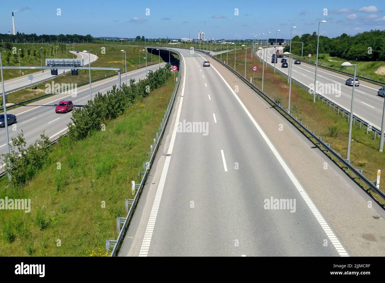 A beautiful shot of a highway with different cars and road signs Stock ...