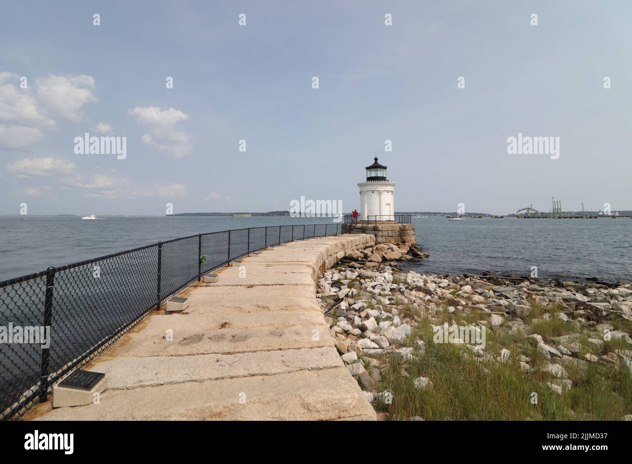A scenic view of a rocky road leading to Bug Light Park in the USA ...