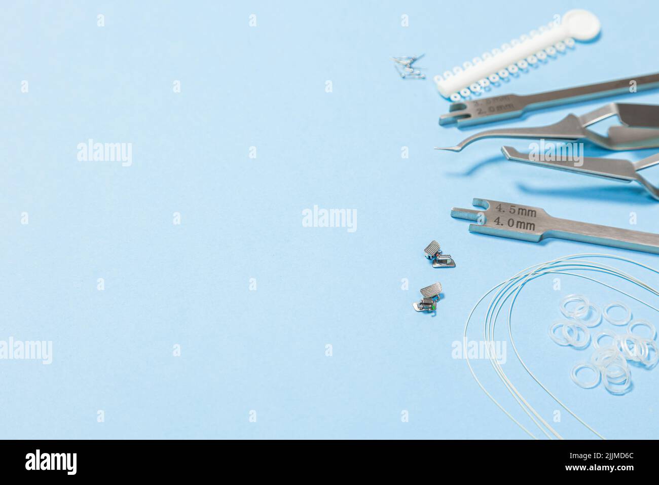 a set of special tools for an orthodontist to install braces for a ...