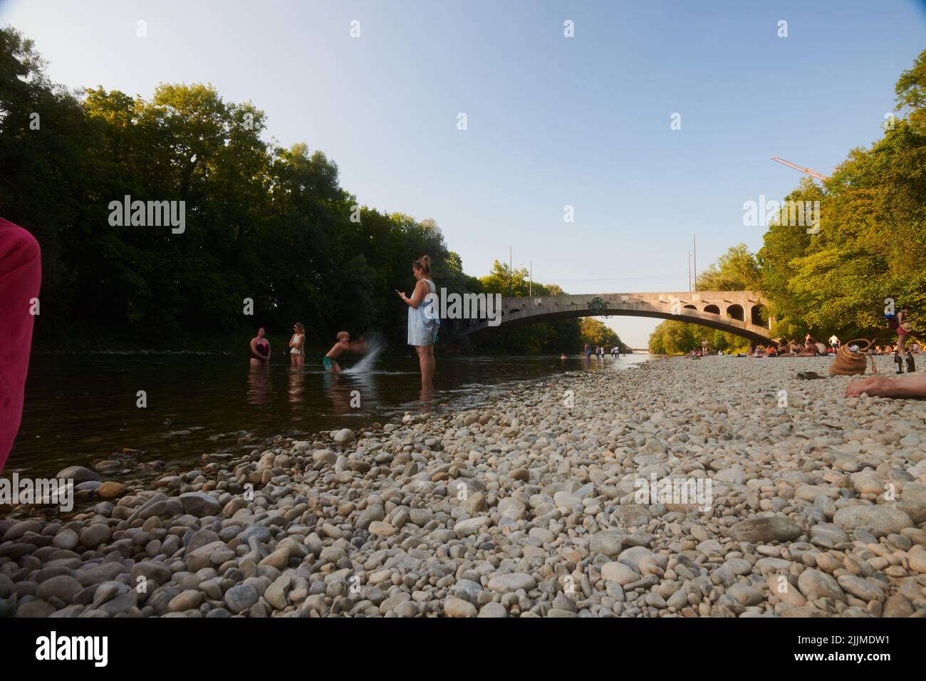 People enjoying bathing in the river Isar in the city of Munich Stock ...