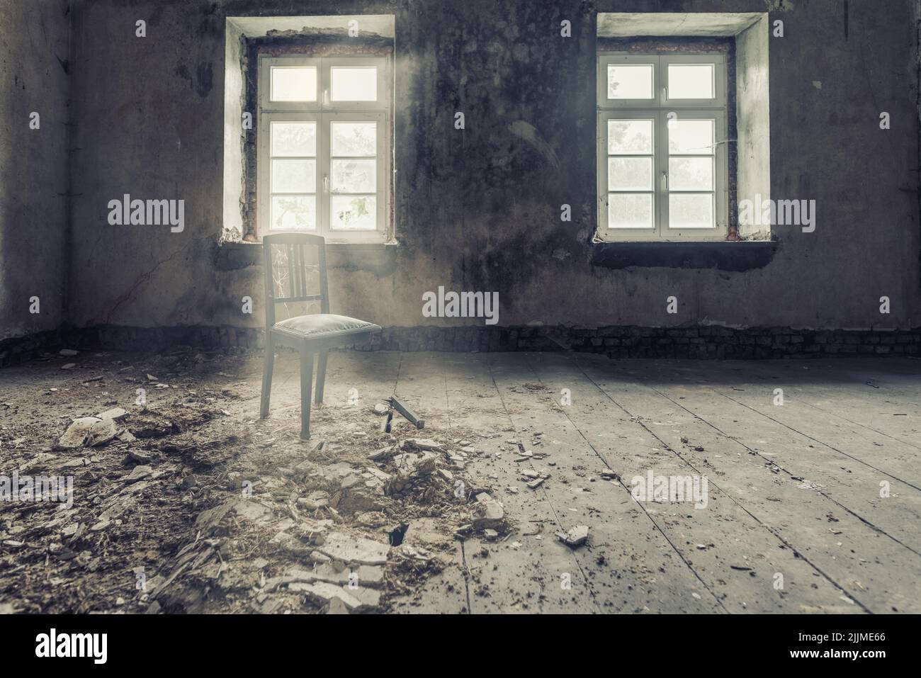 A broken dusty old room interior with broken walls and a chair Stock ...