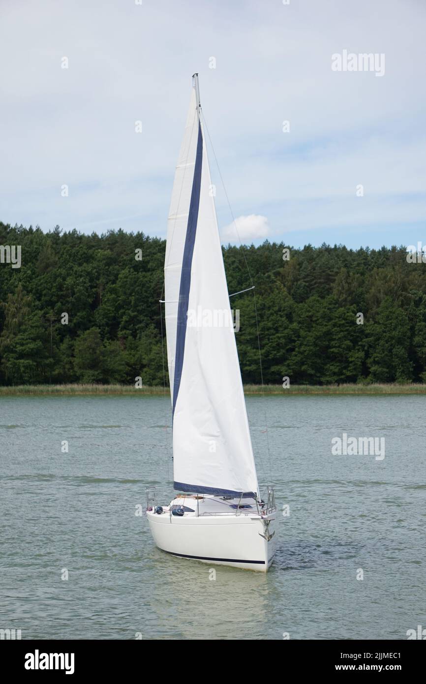 Sailboat swimming on a lake - front view Stock Photo - Alamy
