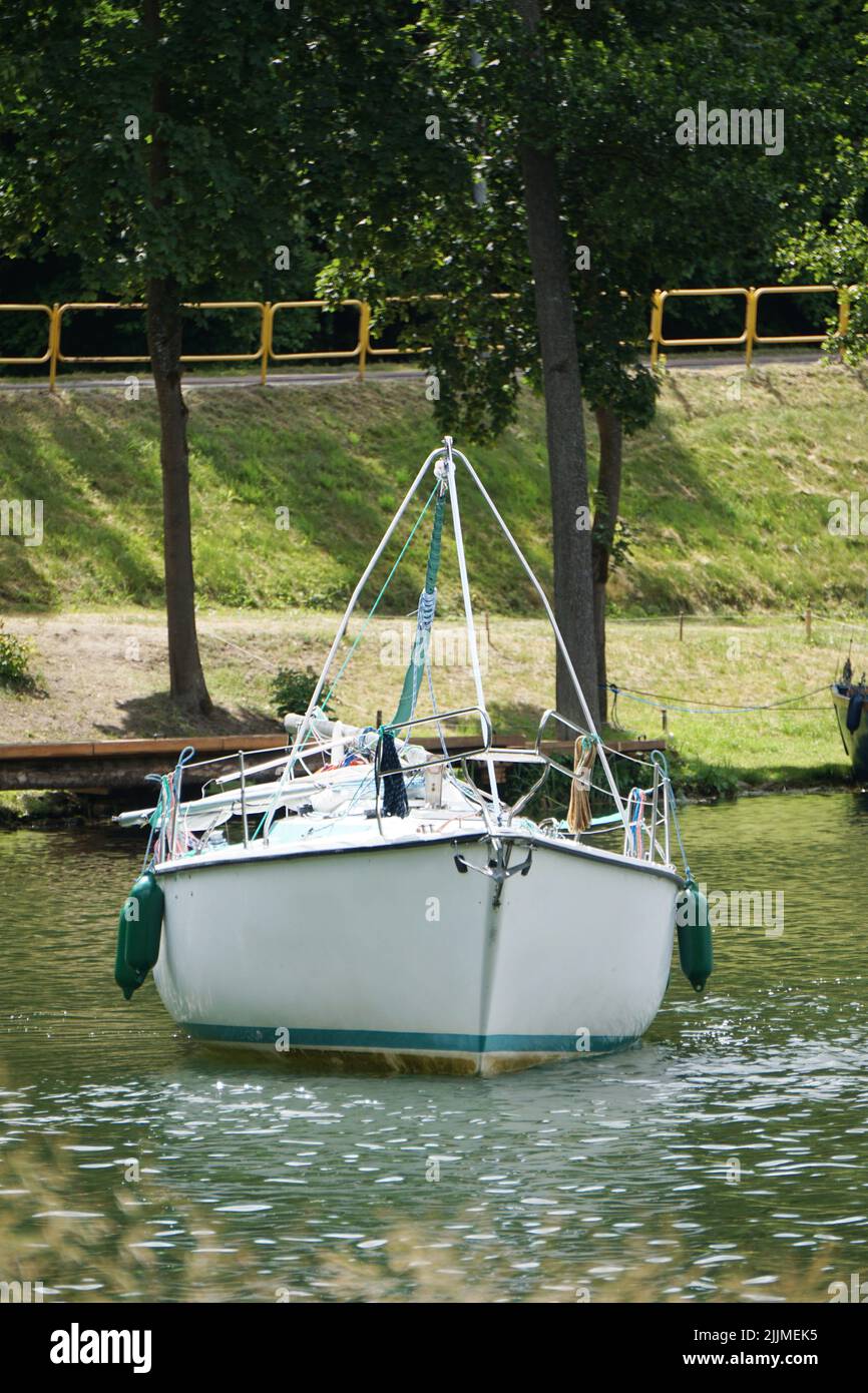 Sailboat swimming with en engine - front view Stock Photo - Alamy