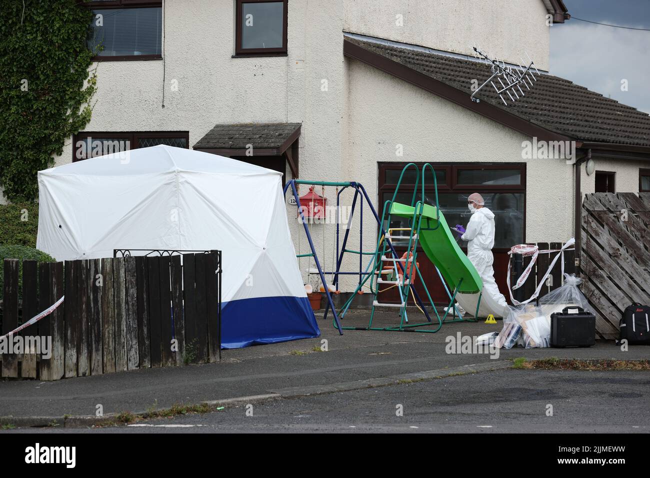 Forensic investigators at the scene in Orkney Drive in Ballymena after ...