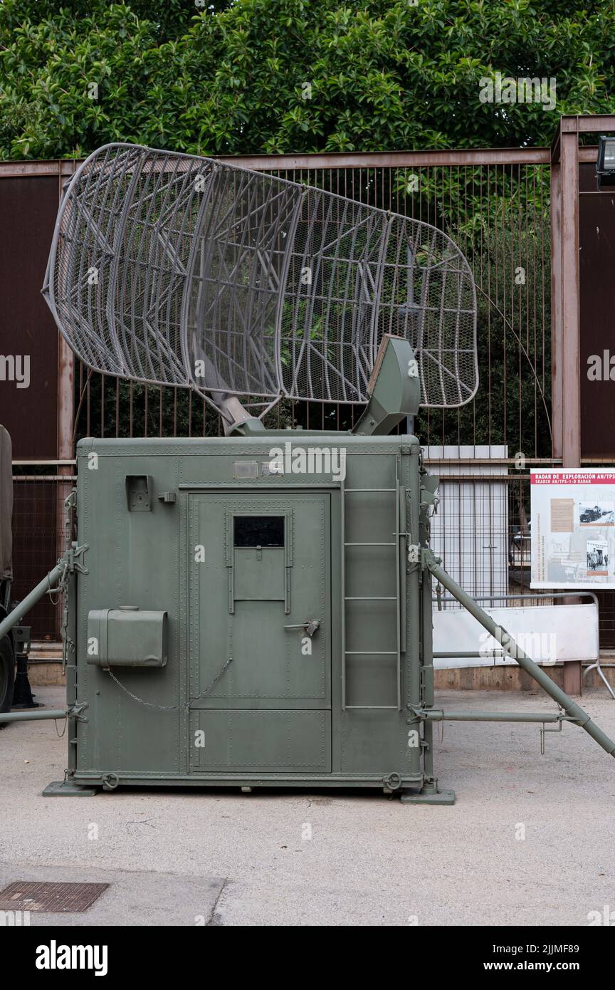 A vertical shot of a military mobile radar antenna group in the street ...