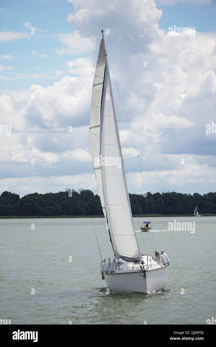 Sailboat swimming on a lake - front view Stock Photo - Alamy