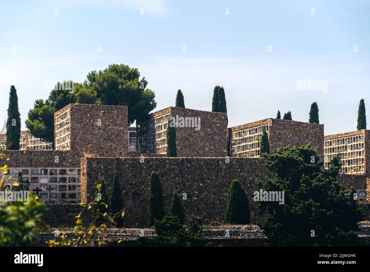 a photo of old buildings covered with small rocks Stock Photo - Alamy